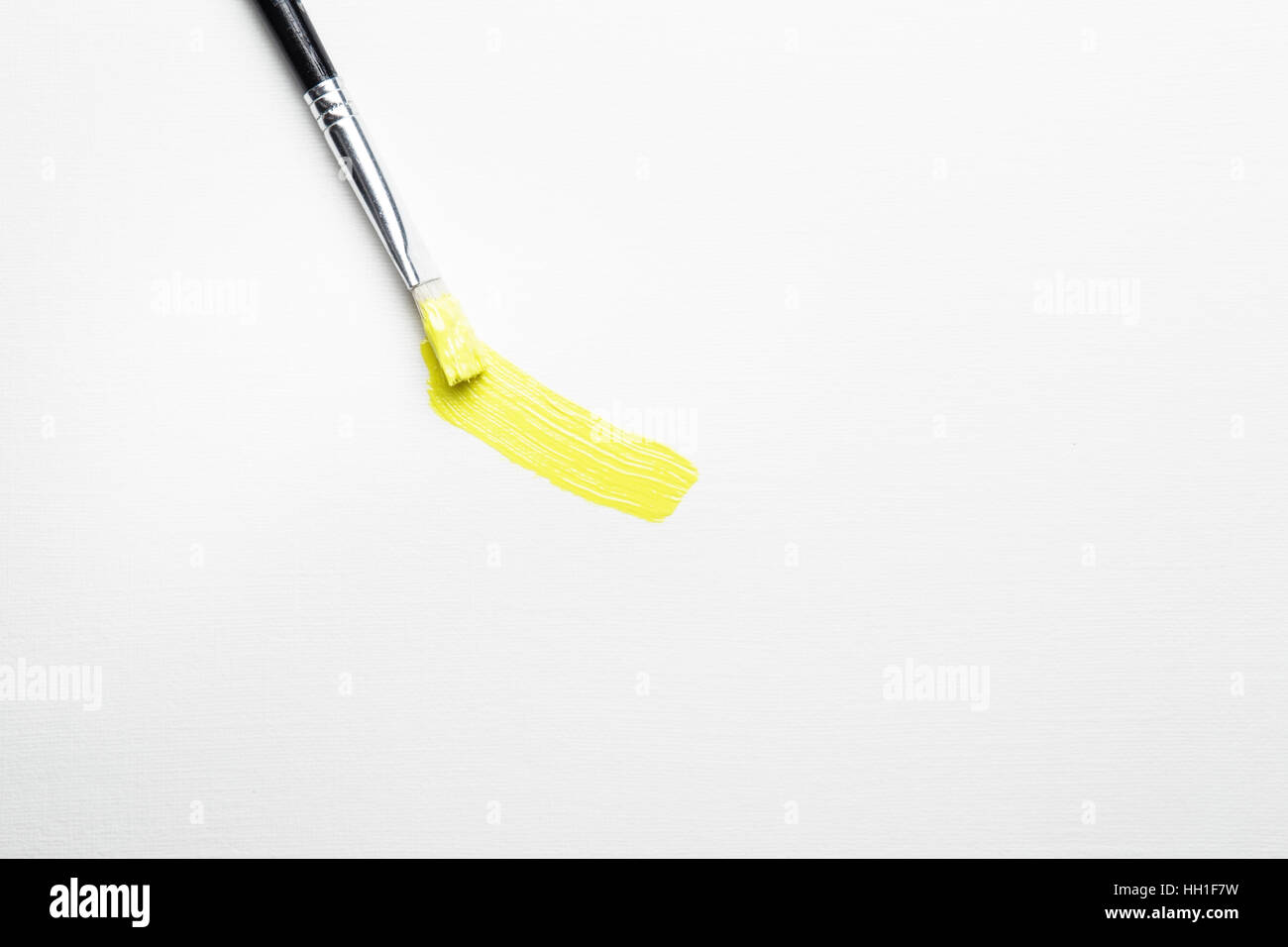 white paper background with a single paint brush Stock Photo - Alamy