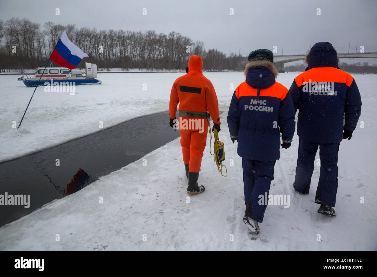 Workers of the Ministry of Emergency Situations inspect the open waters ...