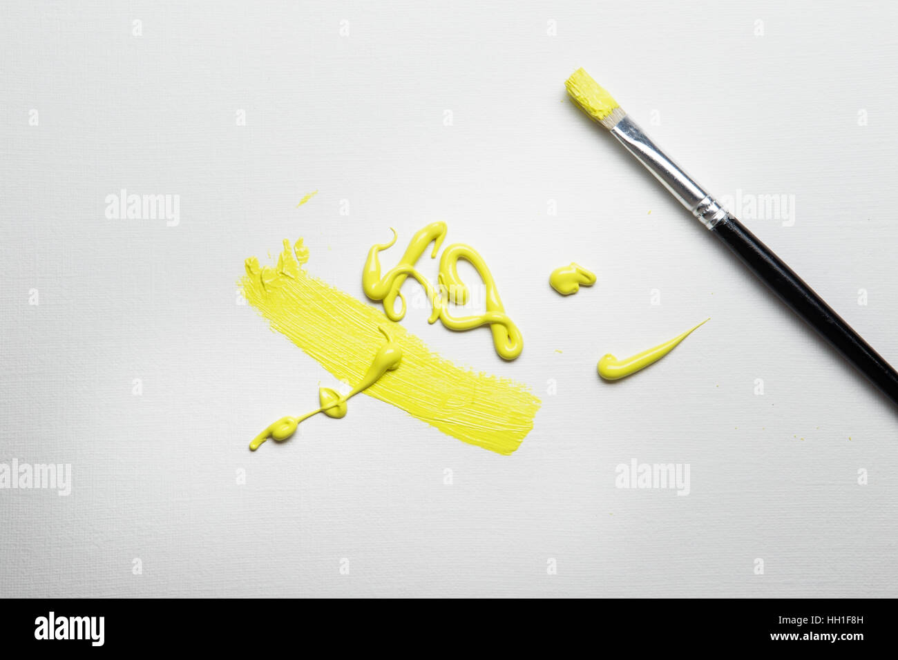 white paper background with a single paint brush Stock Photo - Alamy