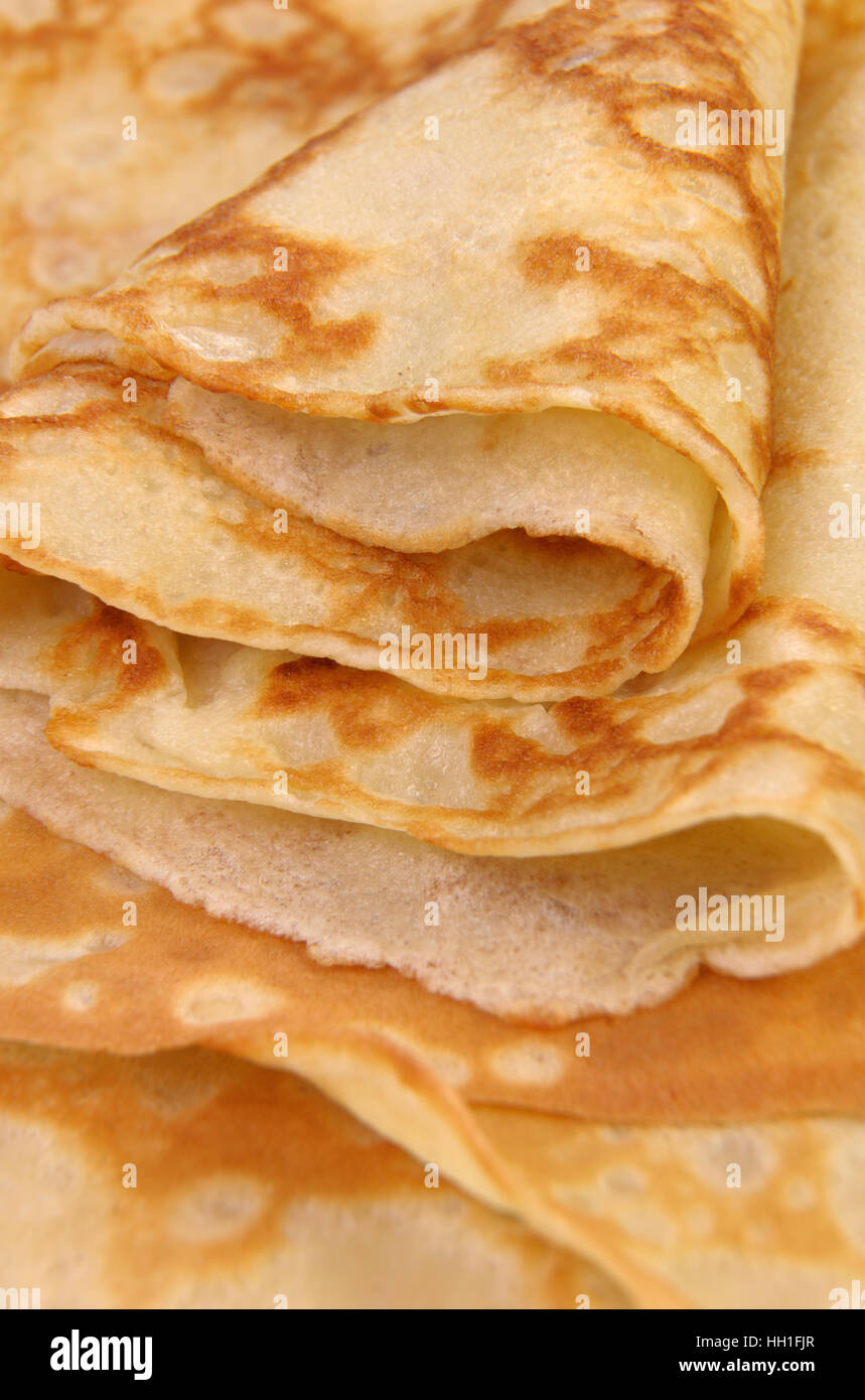 stack of folded crispy fried thin pancake closeup Stock Photo - Alamy