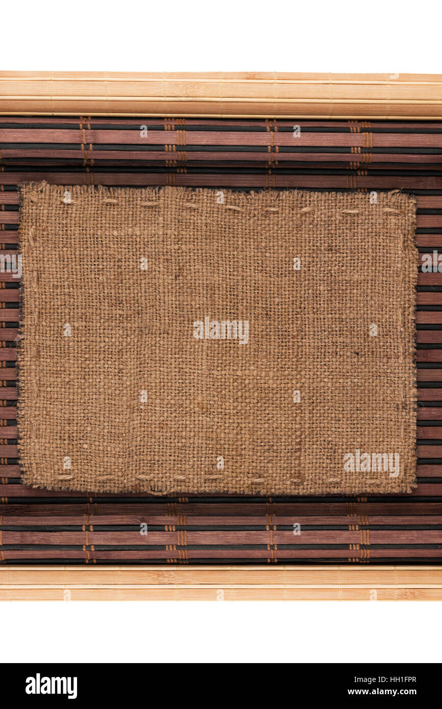 Frame made of burlap lying on a bamboo mat in the form of manuscript ...