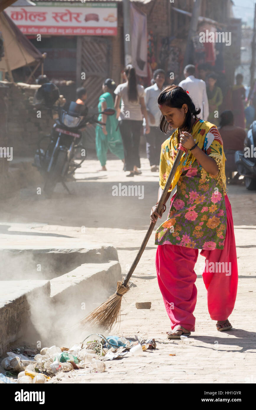 Local woman sweeping the streets of Kathmandu Stock Photo - Alamy