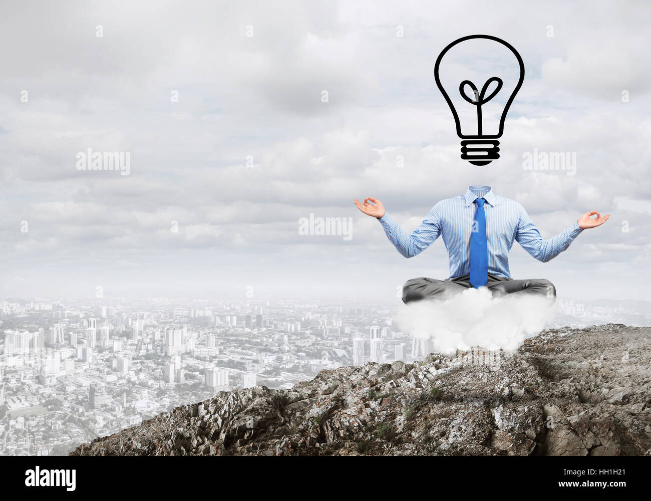Headless businessman meditating Stock Photo - Alamy