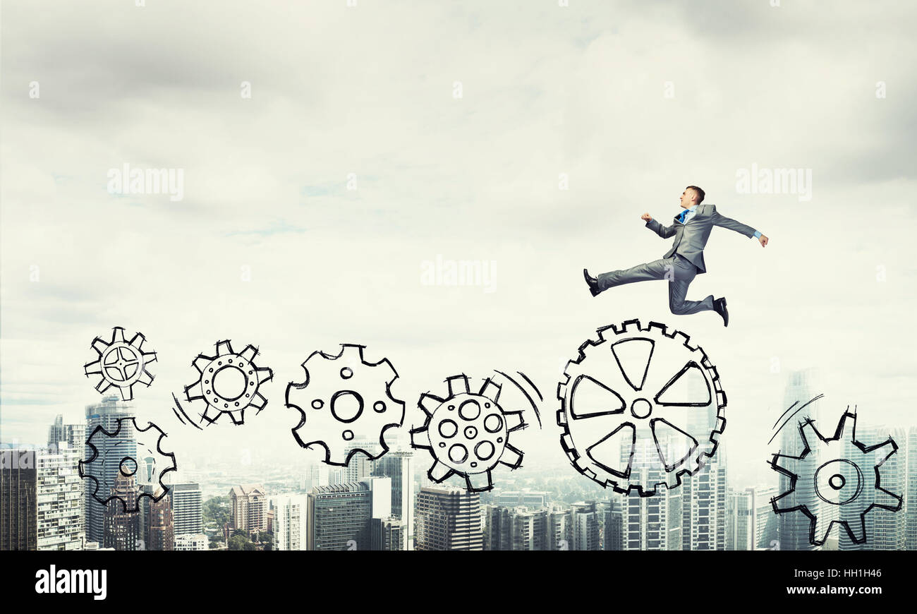 Businessman jumping high Stock Photo - Alamy