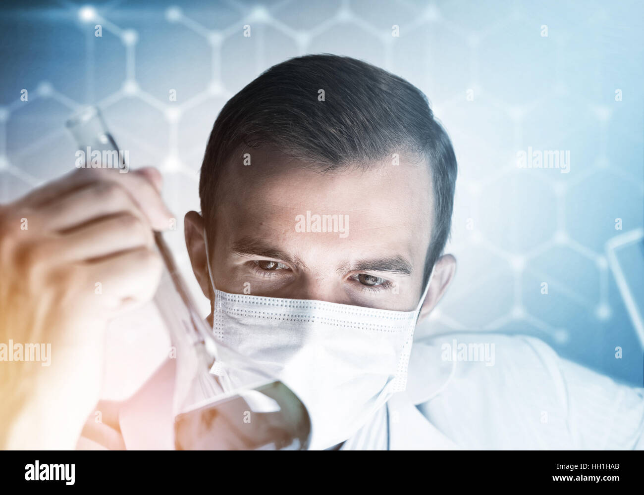 Portrait of concentrated male scientist working with reagents in laboratory Stock Photo - Alamy