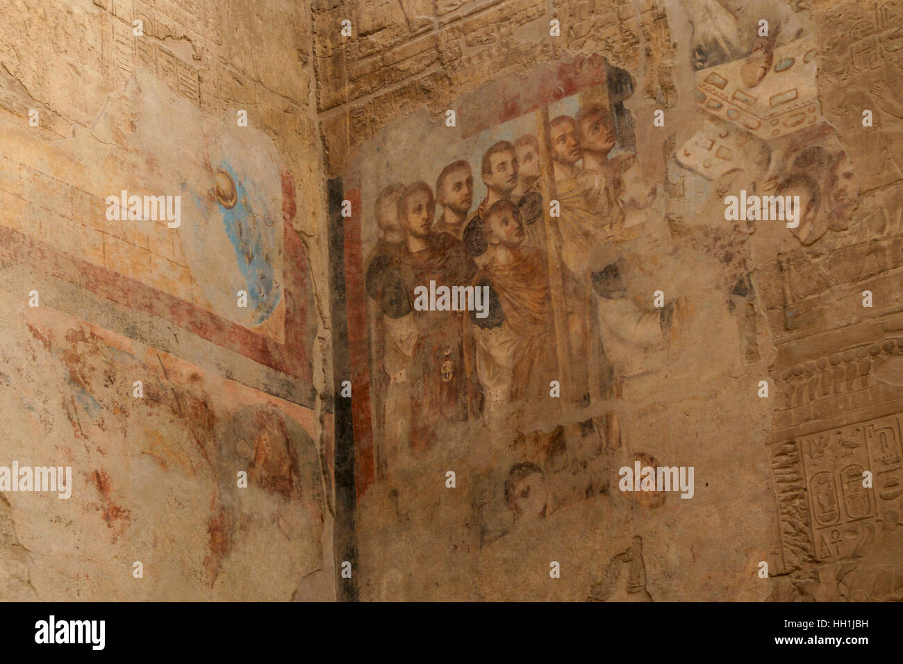 Coptic paintings cover Egyptian carvings at the Temple of Karnak, Egypt ...