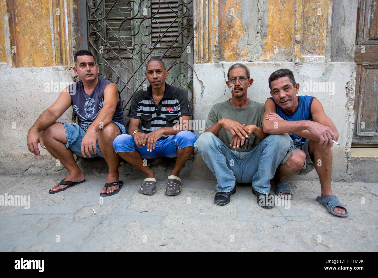 Guys hanging out in Old Havana Stock Photo - Alamy