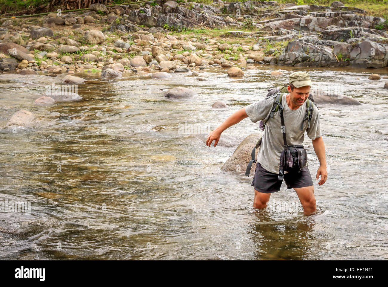 Man crossing the river in the Madagascar jungle Stock Photo - Alamy