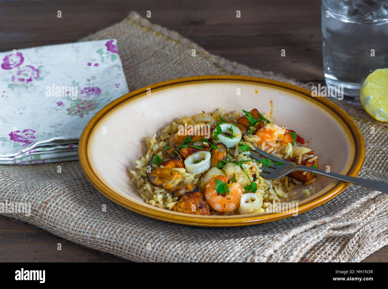 Seafood pilaf or risotto on a plate Stock Photo - Alamy