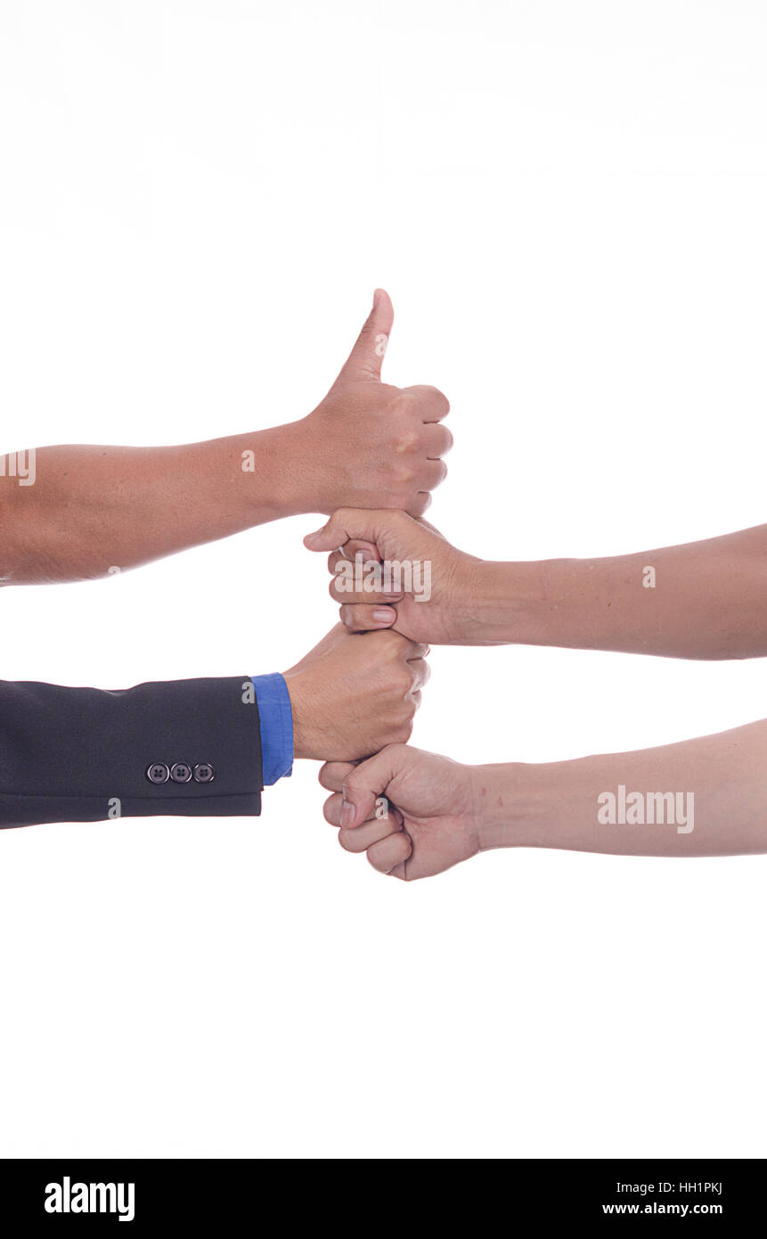 Clenched hands of people on each other to win at the end on white ...