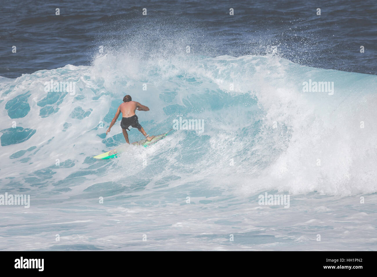 Man at beach with giant wave hi-res stock photography and images - Alamy