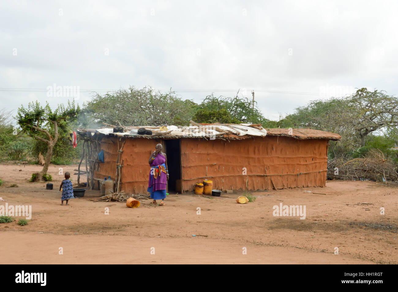 Traditional house of masai in earth and wood in a village of Kenya ...