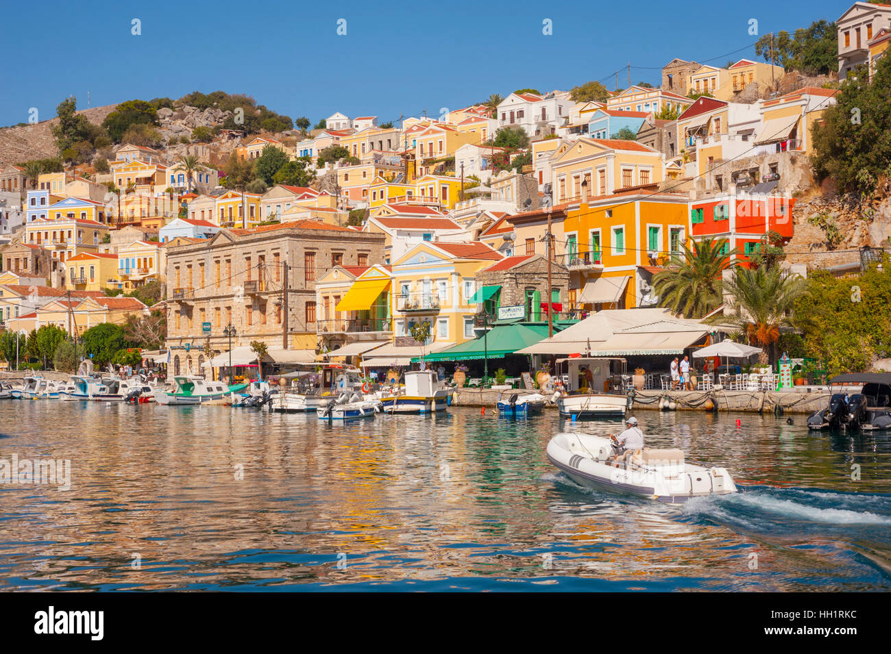 The buildings alongside the harbour on Symi Greece Stock Photo - Alamy