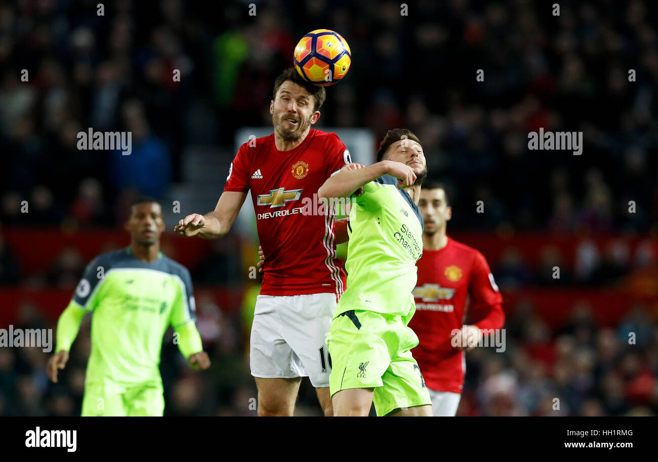 Manchester United's Michael Carrick (left) and Liverpool's Adam Lallana ...