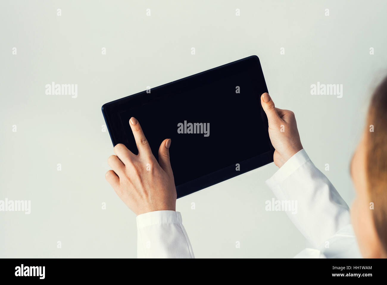 Close of female doctor hands working with tablet pc computer Stock ...