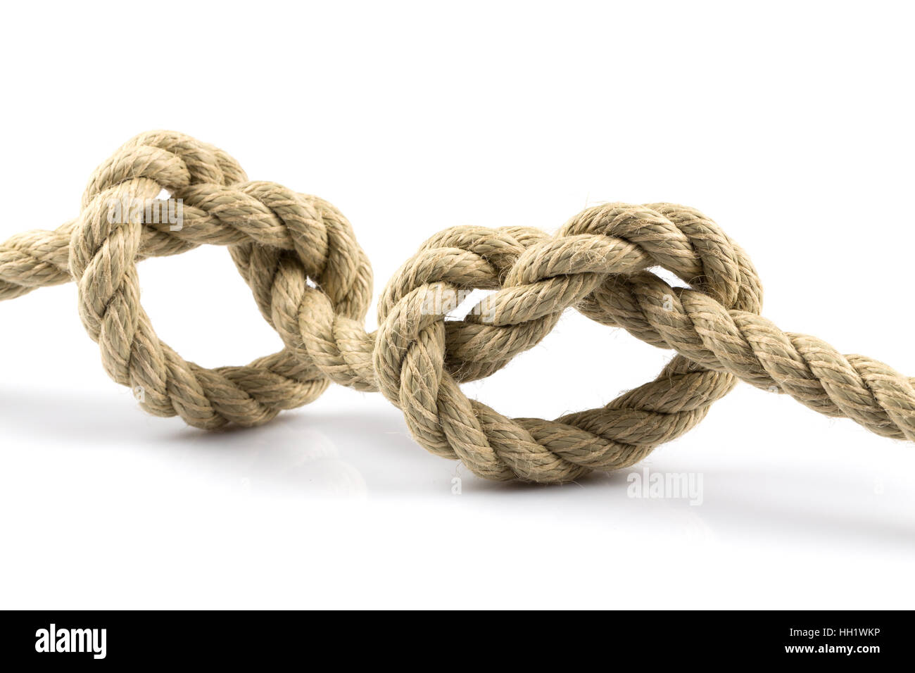 Two heart shape knots of rope isolated on white background Stock Photo ...