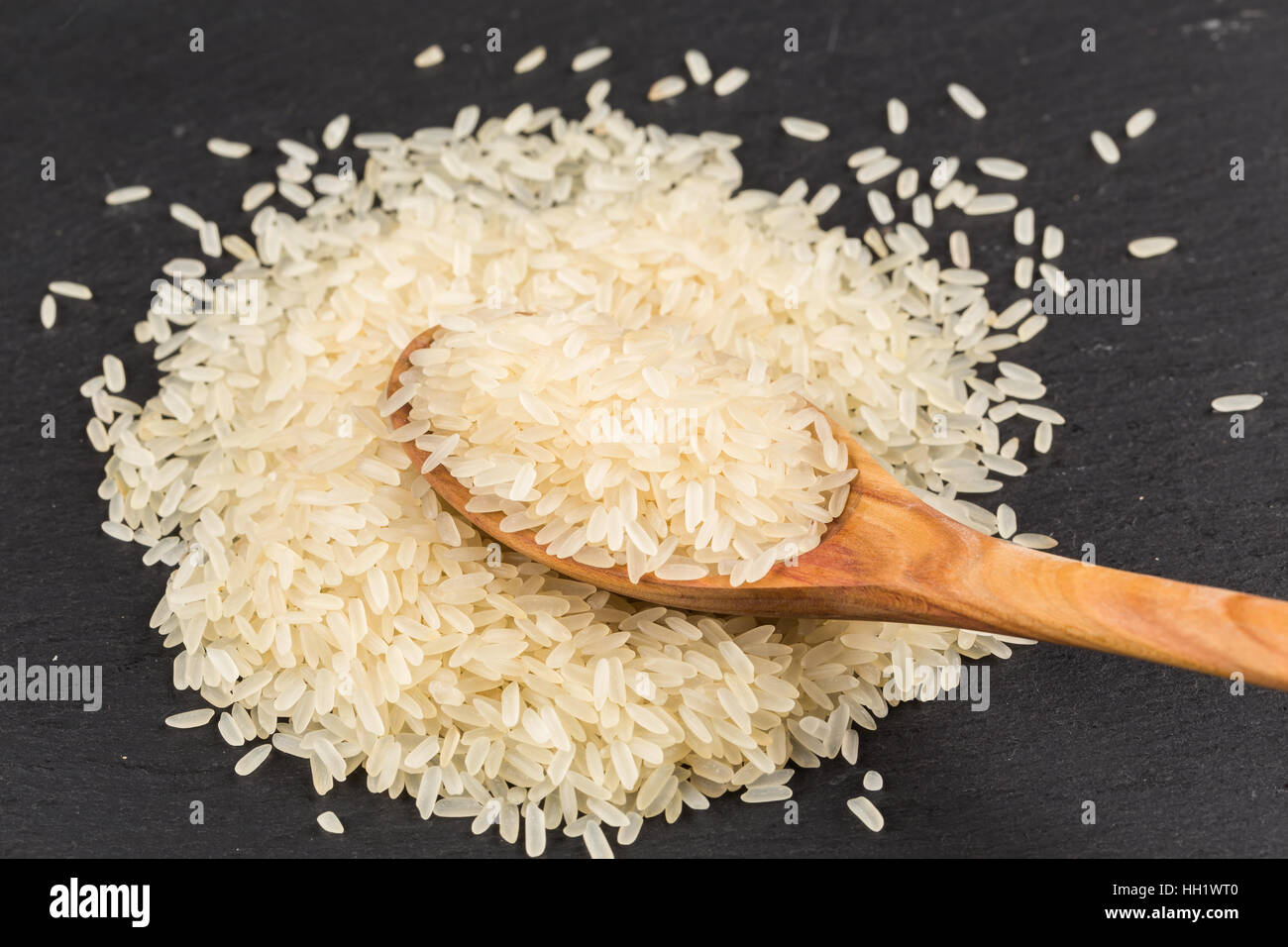 spoon of rice on puffed rice cereal background close up Stock Photo - Alamy