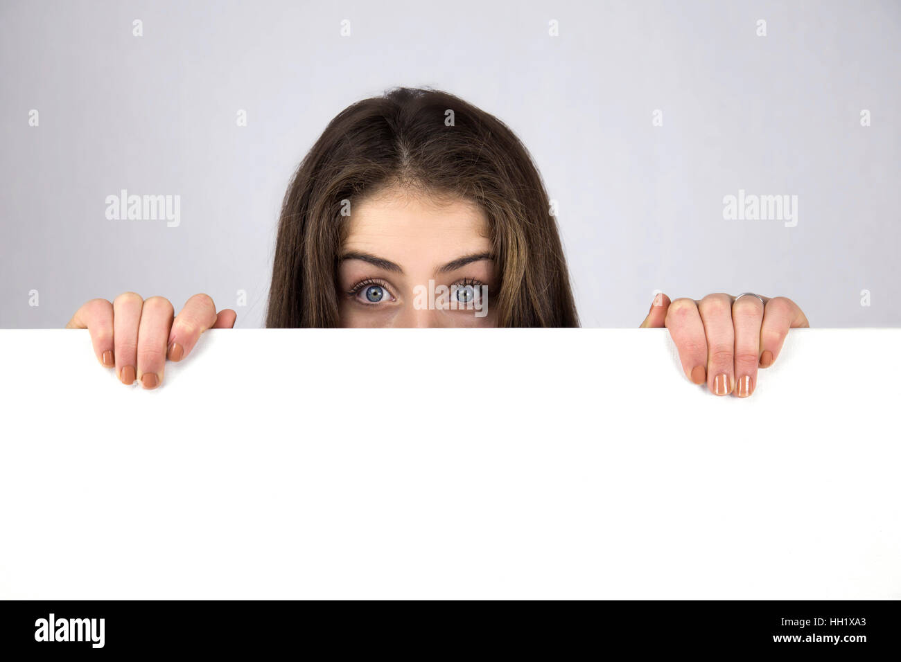 woman holding empty poster Stock Photo - Alamy