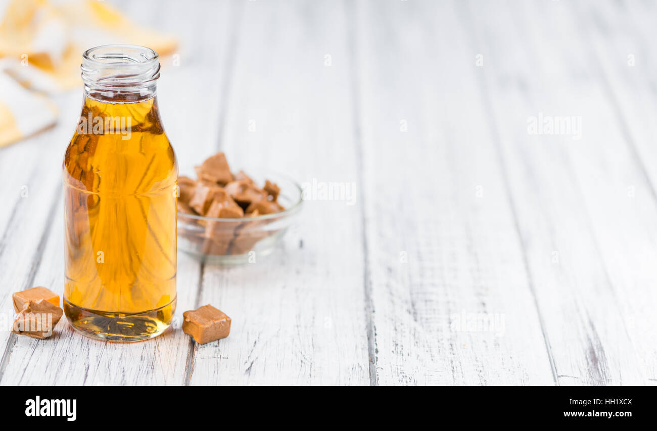 Caramel Sirup on a vintage background as detailed close-up shot ...