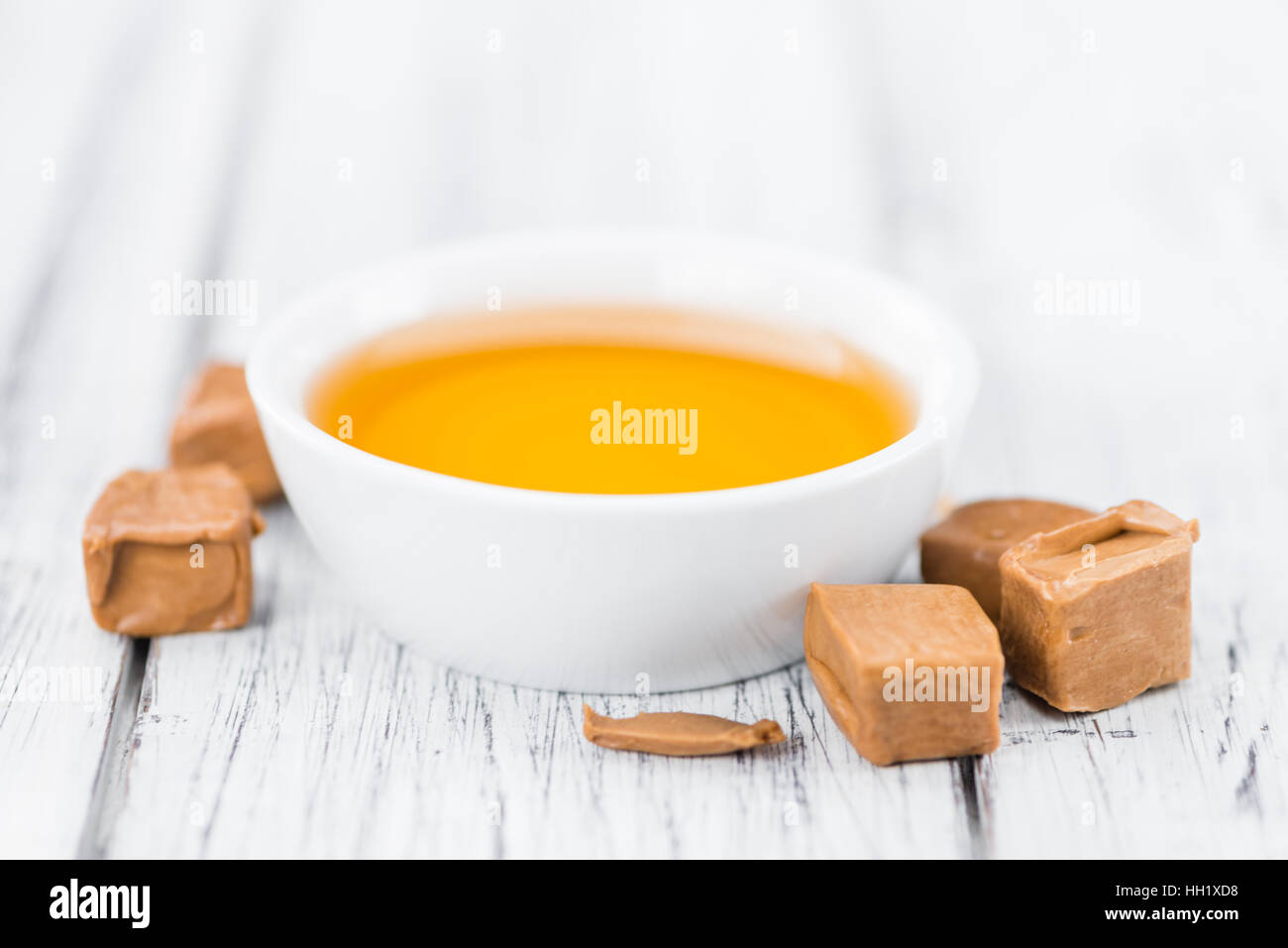 Caramel Sirup on a vintage background as detailed close-up shot ...