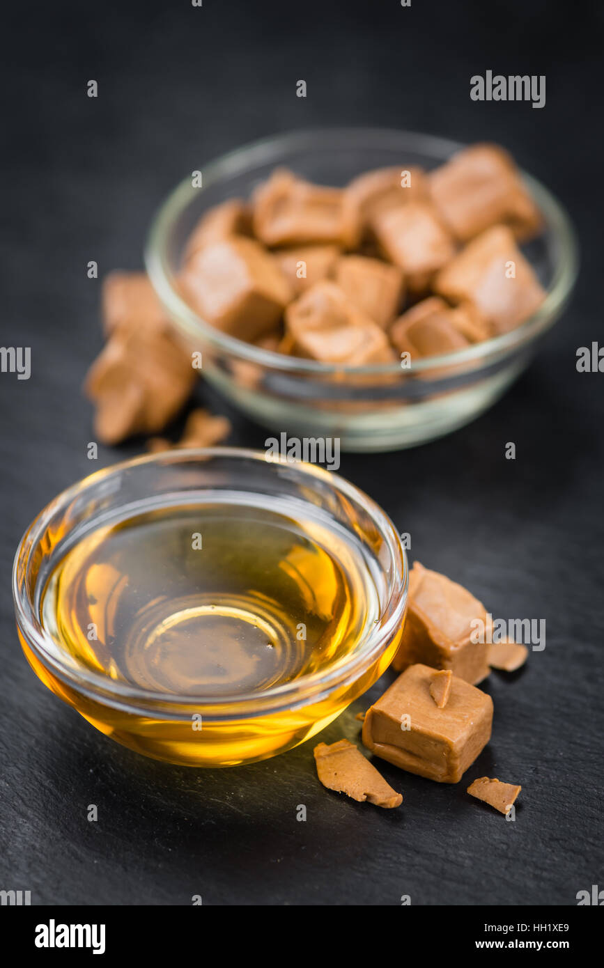 Caramel Sirup on a vintage background as detailed close-up shot ...