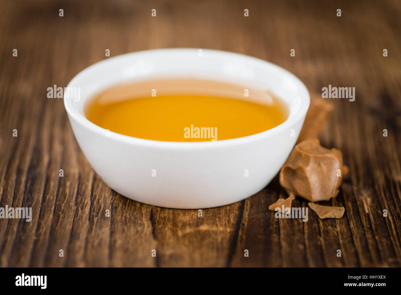 Caramel Sirup on a vintage background as detailed close-up shot ...