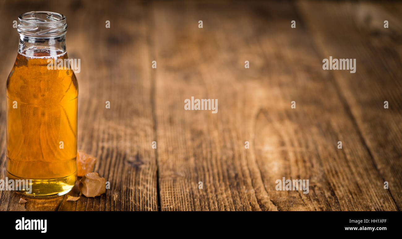 Caramel Sirup on a vintage background as detailed close-up shot ...