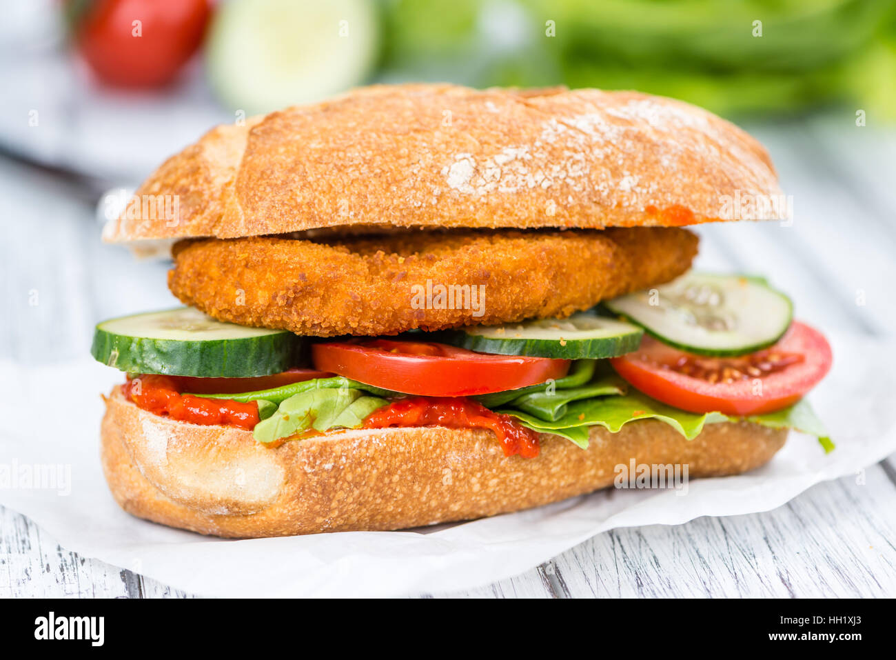 Chicken Schnitzel on a bun (selective focus; detailed close-up shot ...