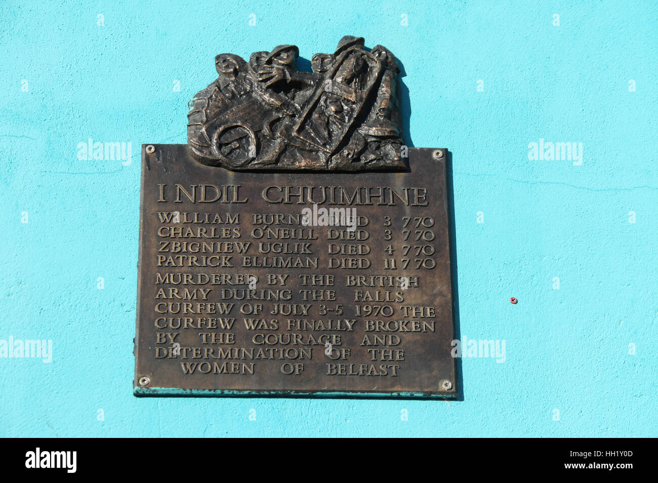 Memorial plaque on the Falls Road for those who died in the curfew or ...