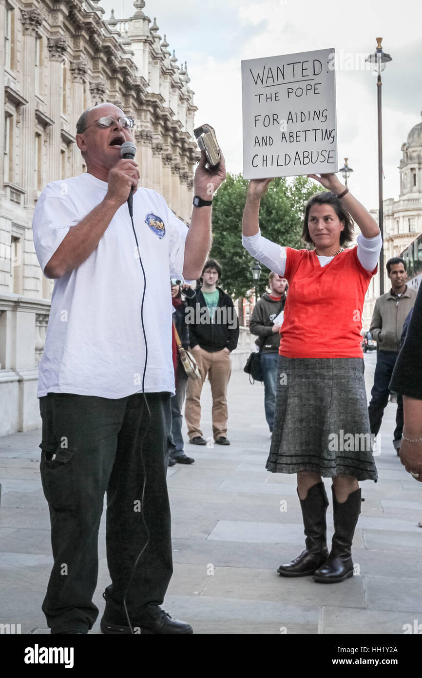An anti-pope protester with placard tries to silence a vocal U.S ...