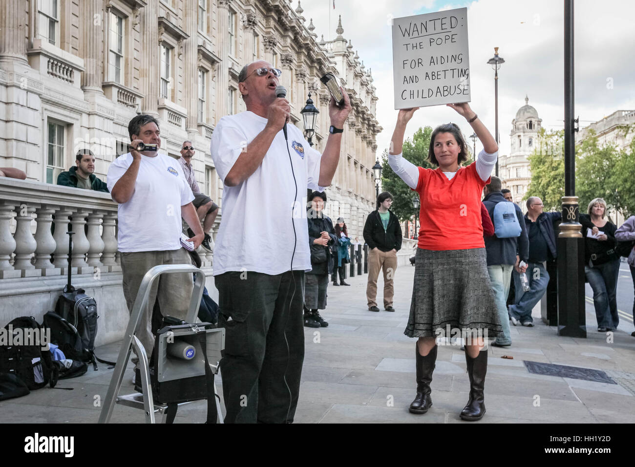 An anti-pope protester with placard tries to silence a vocal U.S ...
