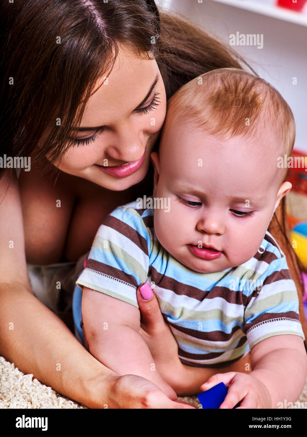 Mother and child playing . Baby with mama fun at home Stock Photo - Alamy