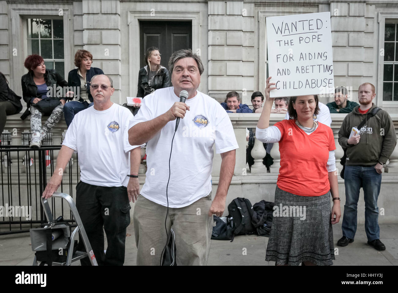 An anti-pope protester with placard tries to silence a vocal U.S ...