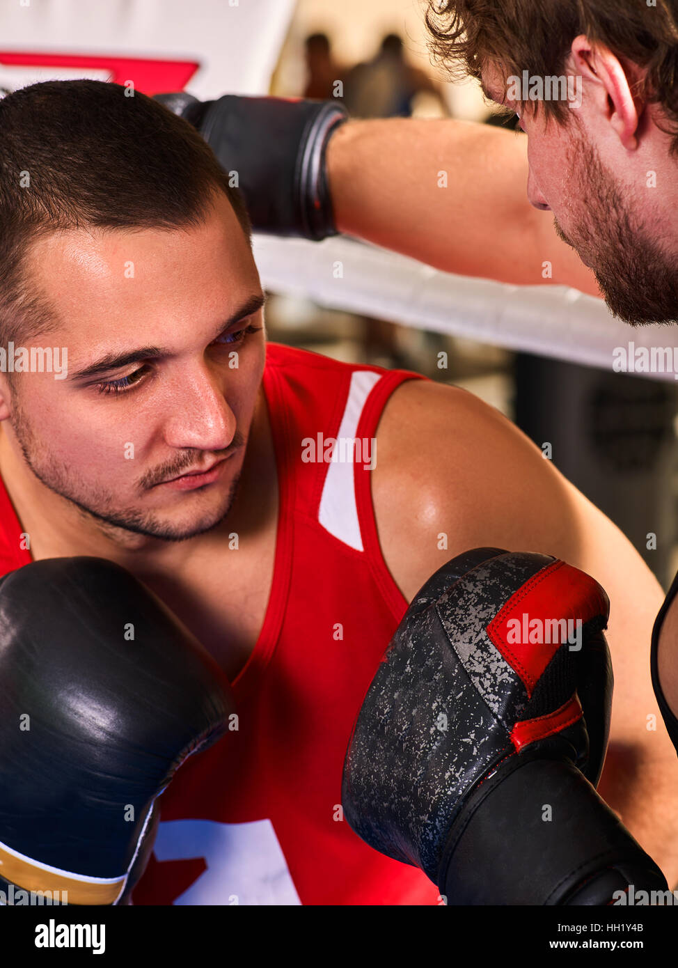 Two men boxer wearing helmet boxing indoor Stock Photo - Alamy