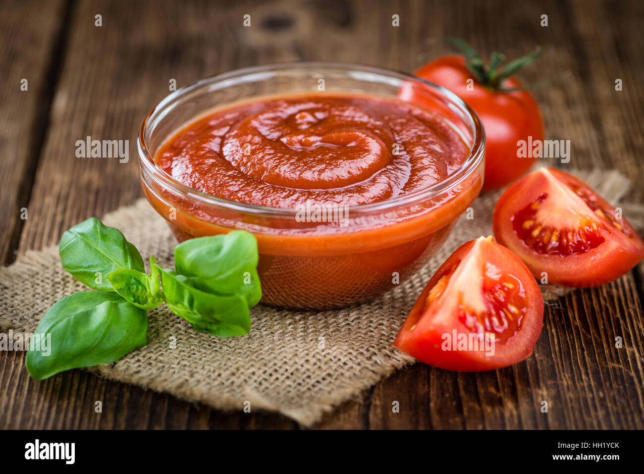 Portion of fresh made Tomato Ketchup (close-up shot; selective focus ...