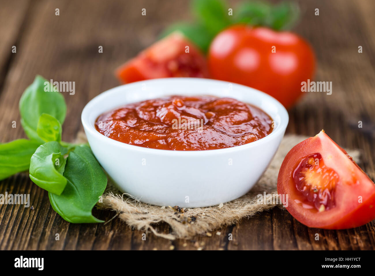 Portion of fresh made Tomato Ketchup (close-up shot; selective focus ...