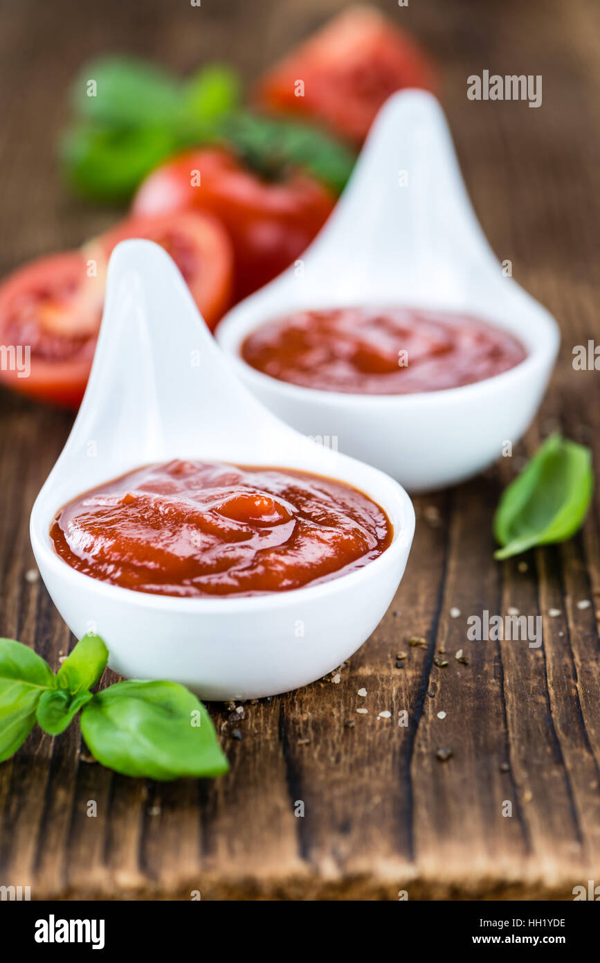 Portion of fresh made Tomato Ketchup (close-up shot; selective focus ...
