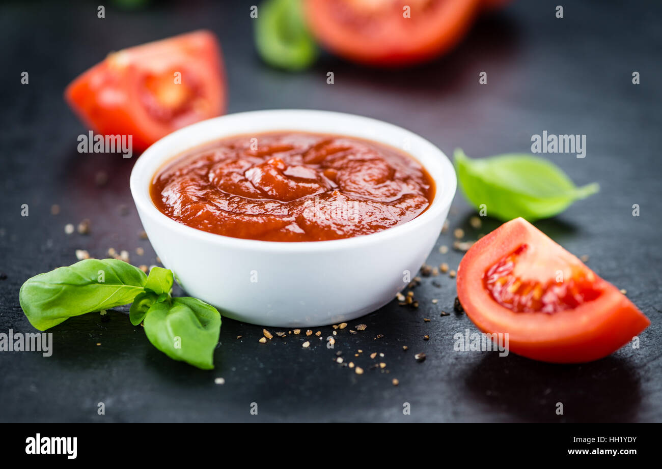 Portion of fresh made Tomato Ketchup (close-up shot; selective focus ...