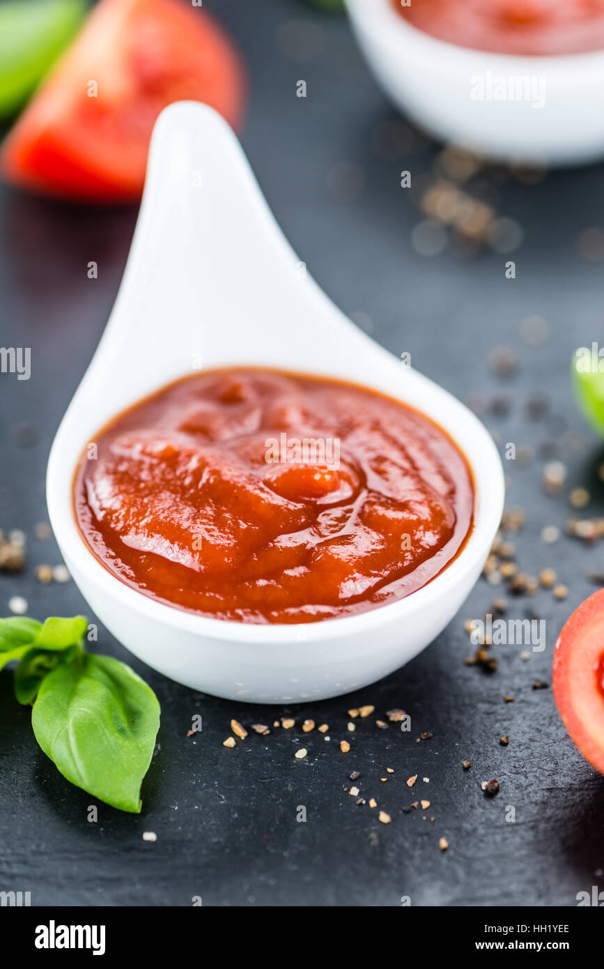 Portion of fresh made Tomato Ketchup (close-up shot; selective focus ...