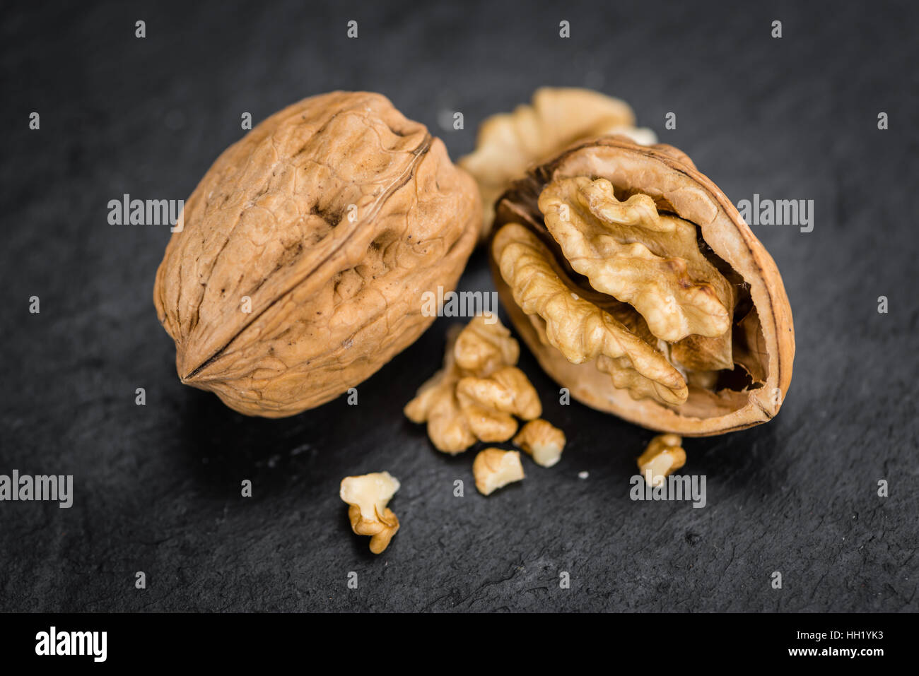 Walnuts on a vintage background as detailed close-up shot (selective ...