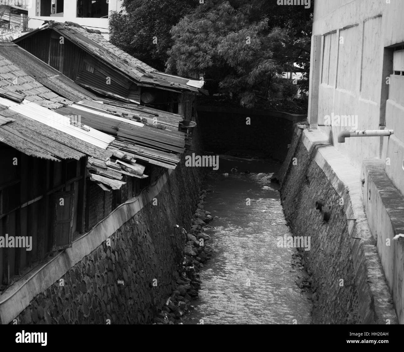 Slums near dirty ditch in black white theme photo taken in Jakarta ...