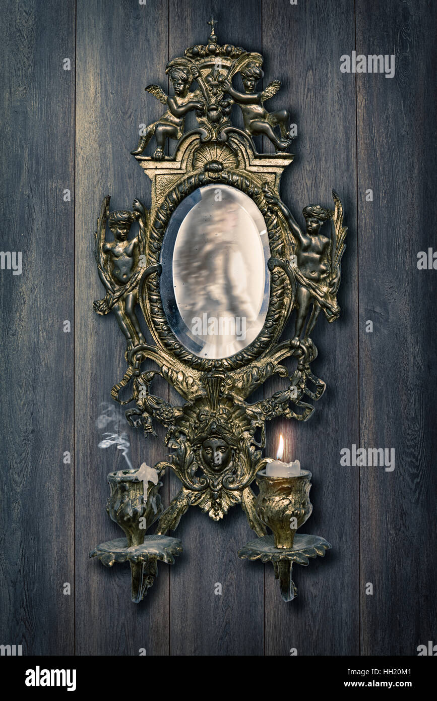 Woman Reflected In French Girondelle with lit candle Stock Photo - Alamy