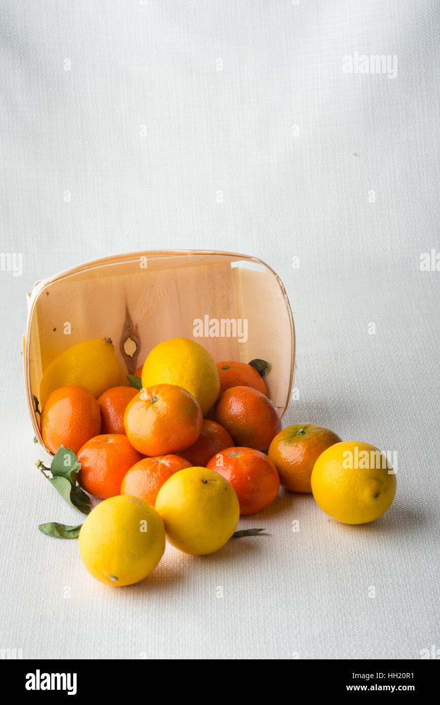 Tangerines and basket Stock Photo - Alamy