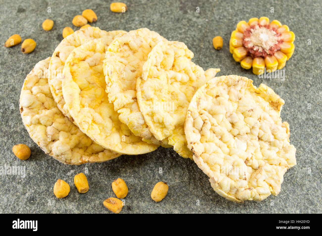 circle shaped corn snacks and corn kernels Stock Photo - Alamy