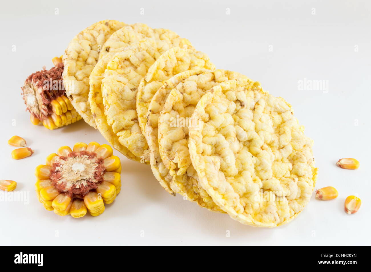 circle shaped corn snacks and corn kernels Stock Photo - Alamy