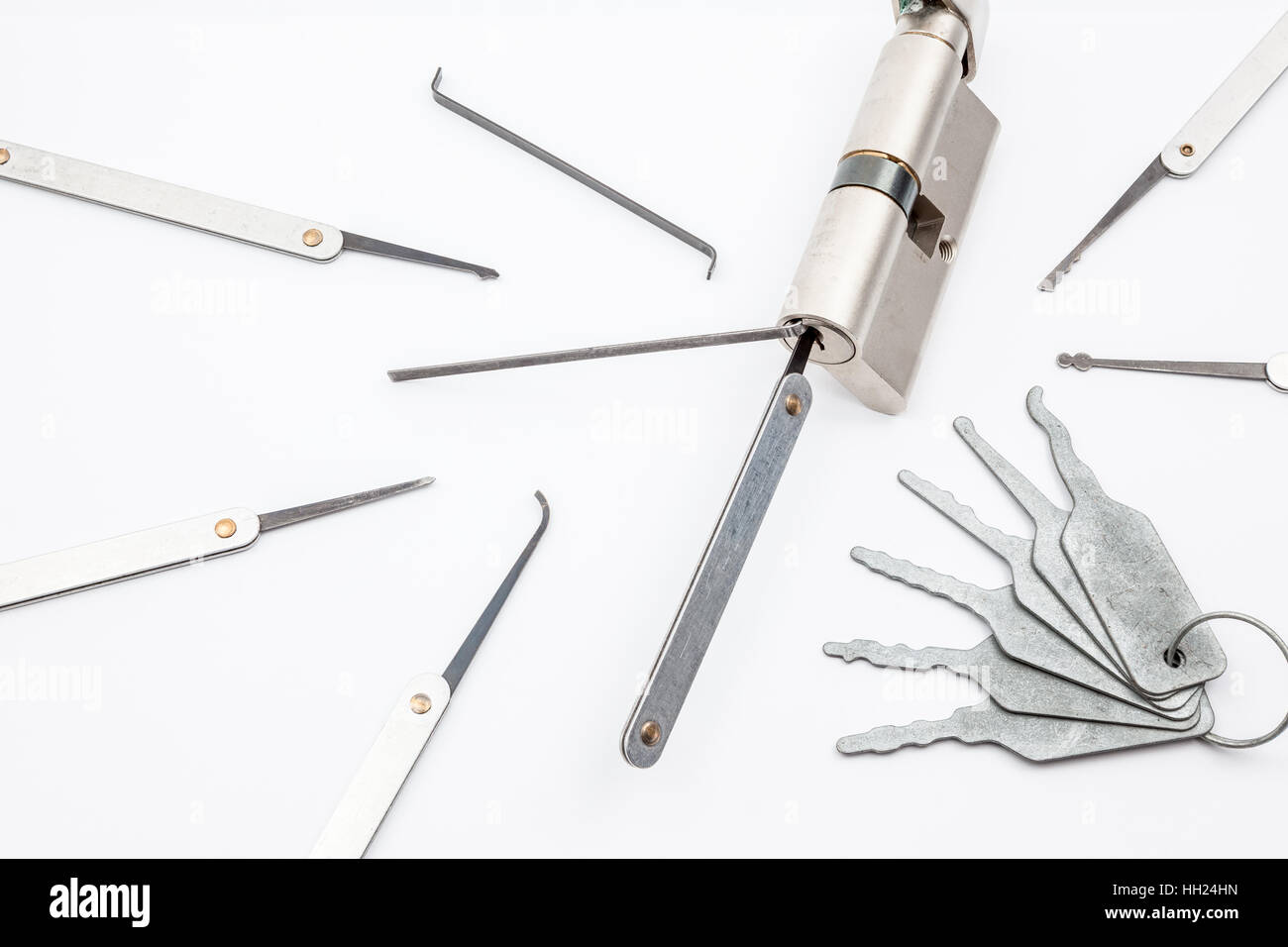 several lockpicking to open a lock on a door Stock Photo - Alamy