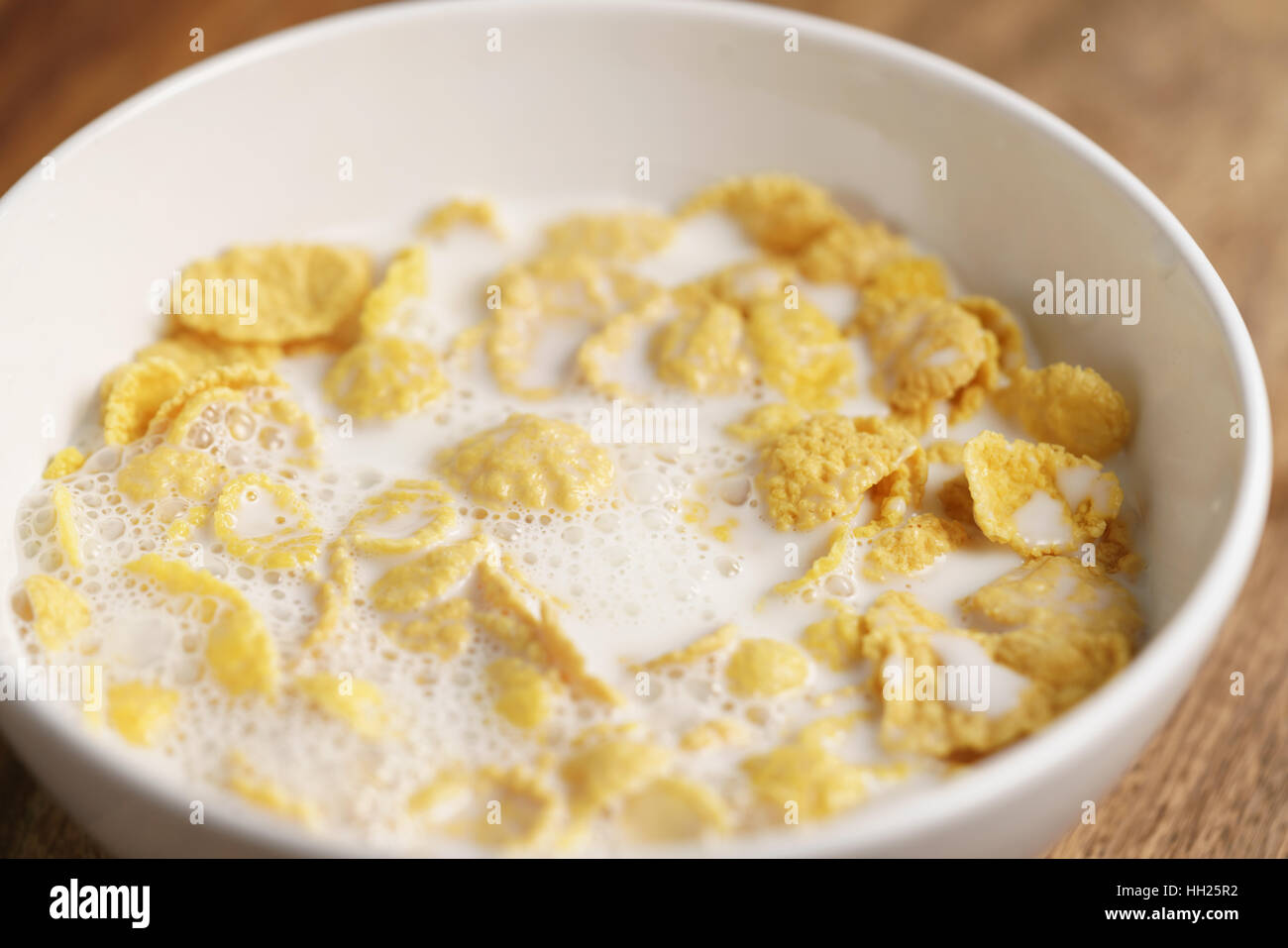 corn flakes with milk in white bowl Stock Photo - Alamy