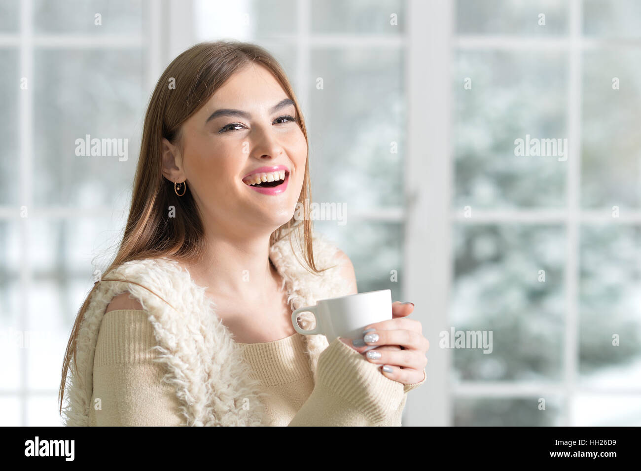 Girl drinking tea Stock Photo - Alamy