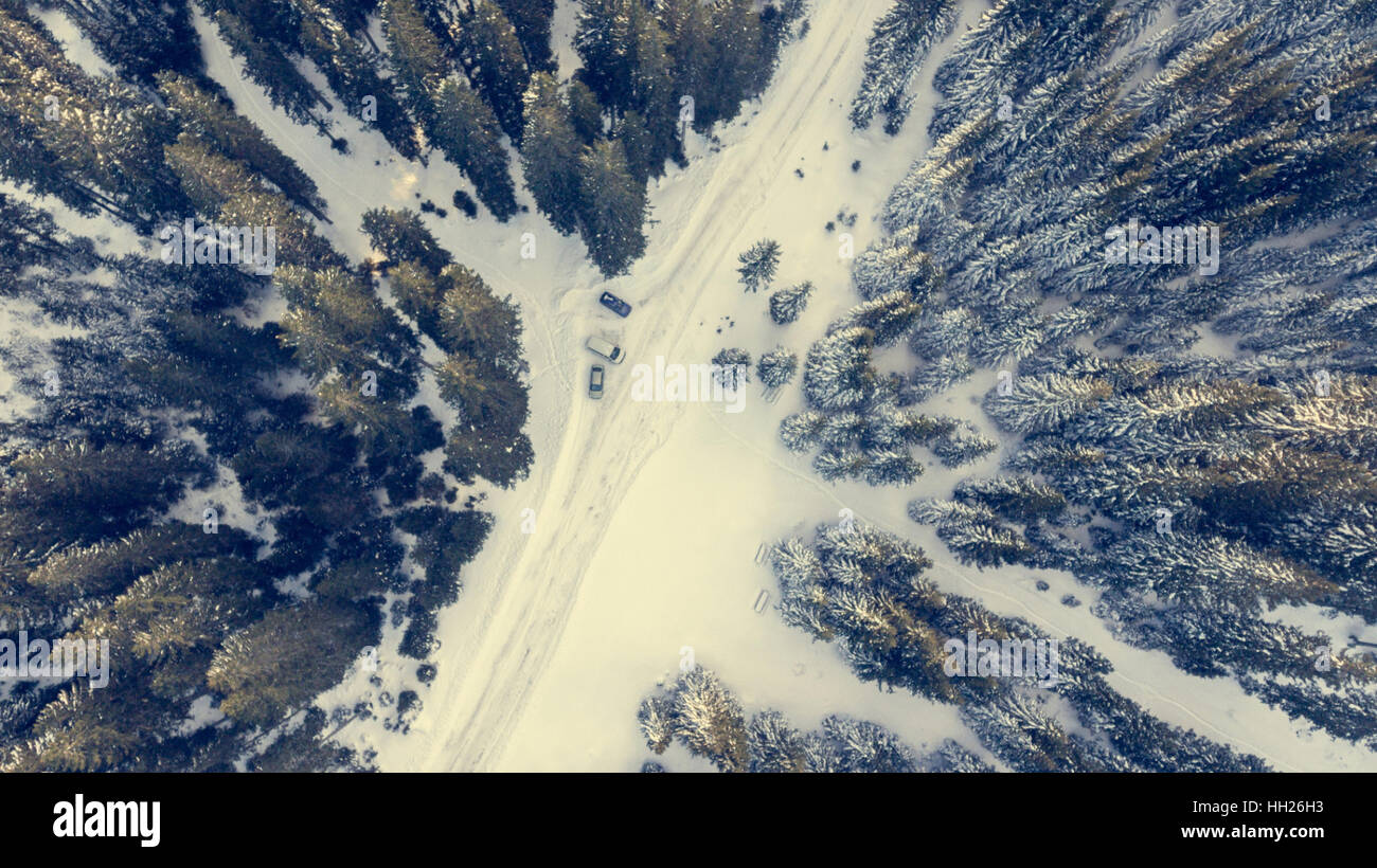 Aerial view of snow covered road through a forest Stock Photo - Alamy
