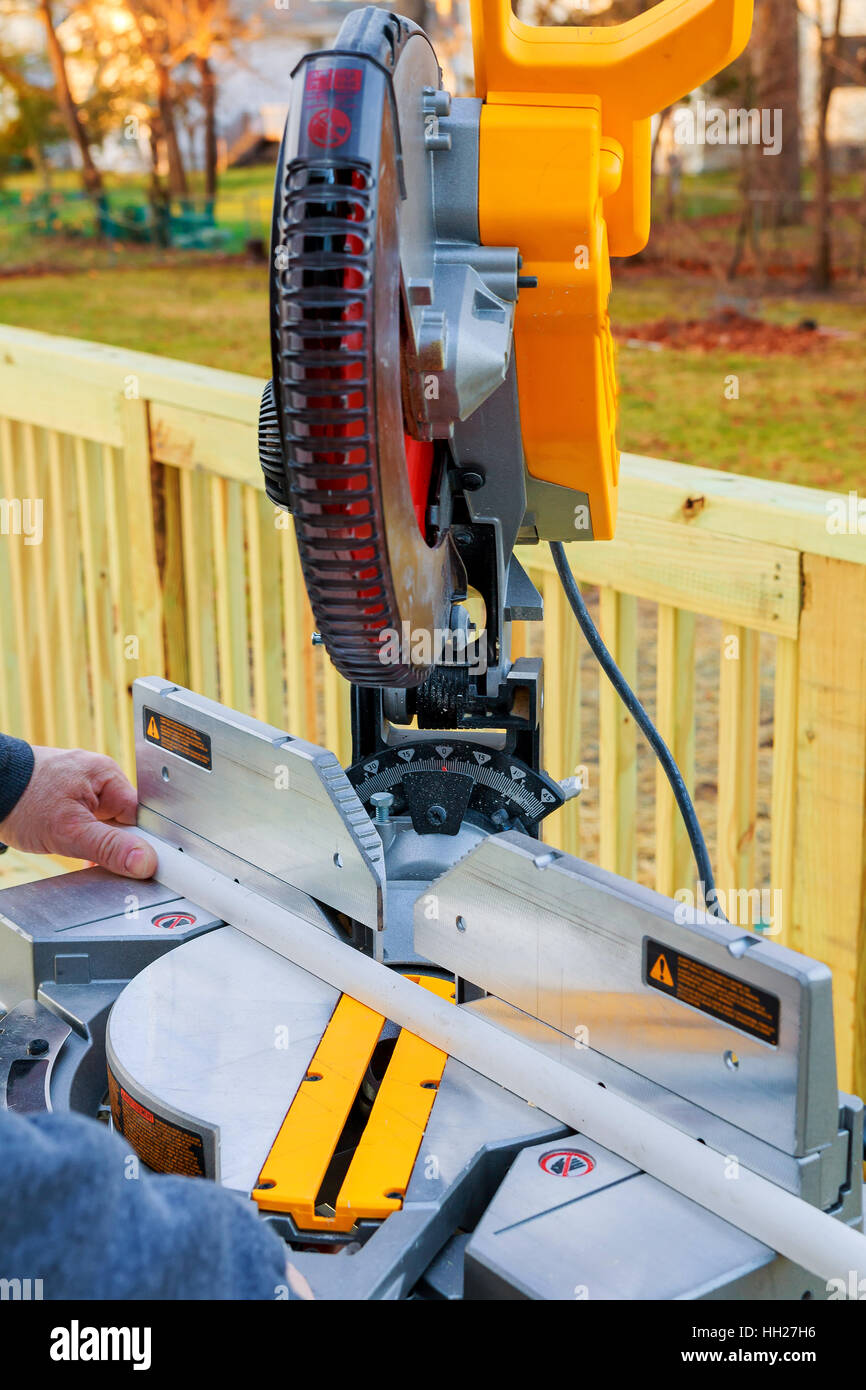 Man, worker sawing wood with a circular saw, machine for wood cutting ...